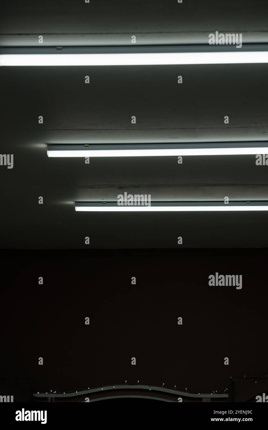 Modern Minimalist Ceiling with Fluorescent Lights in a Dimly Lit Room ...