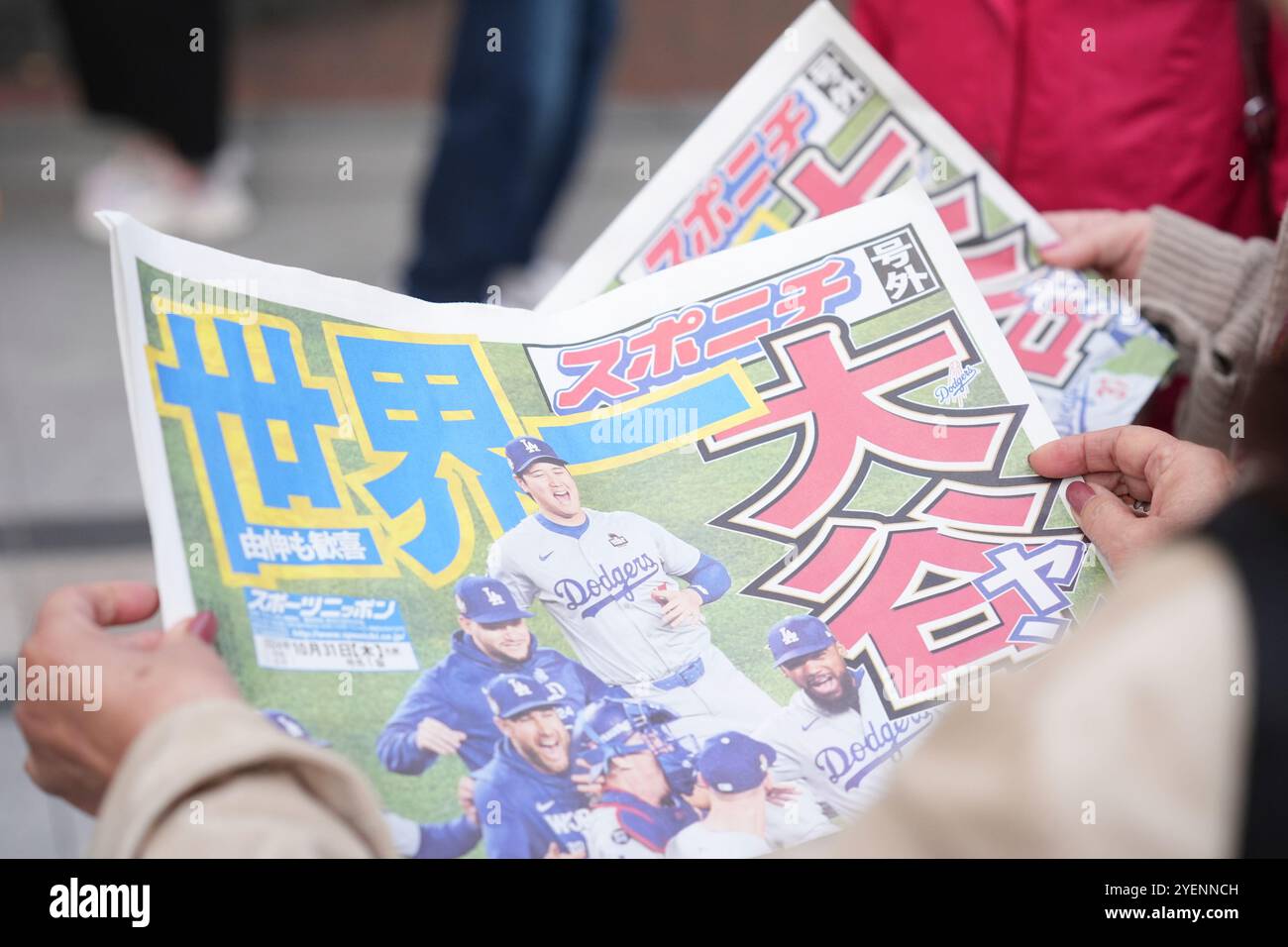 Newspaper extras are distributed announcing the Los Angeles Dodgers ...