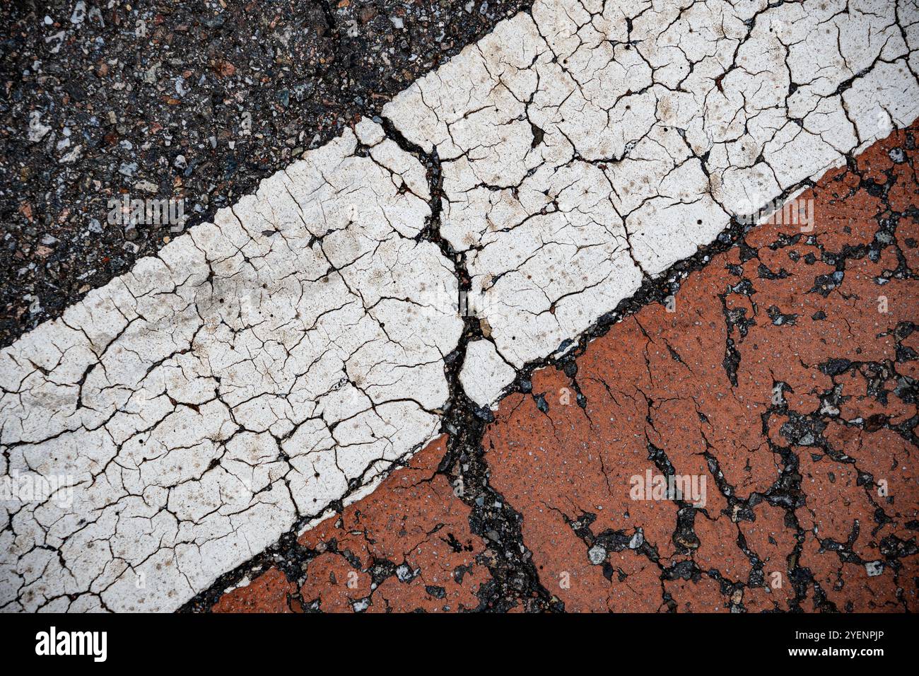 Painted section of asphalt road that separates lanes Stock Photo - Alamy