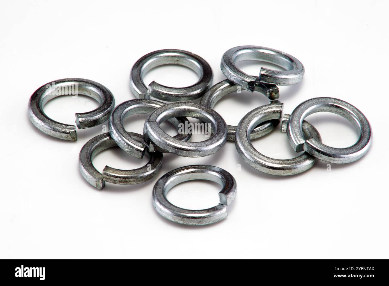 Large split spring washers on white background Stock Photo - Alamy
