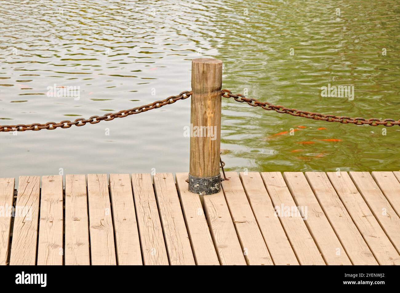 Wharf on piles and the chains Stock Photo - Alamy