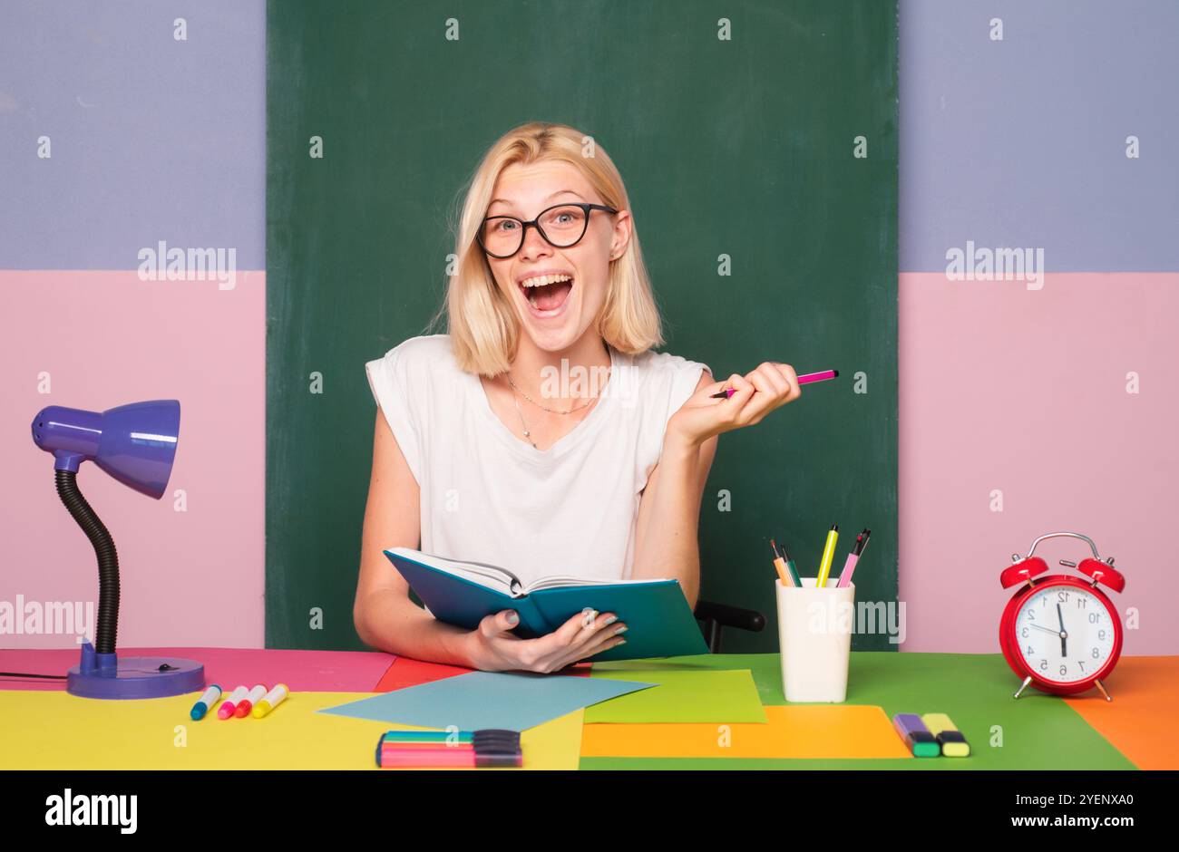 Shcool teacher in class on blackboard background. Professional portrait ...
