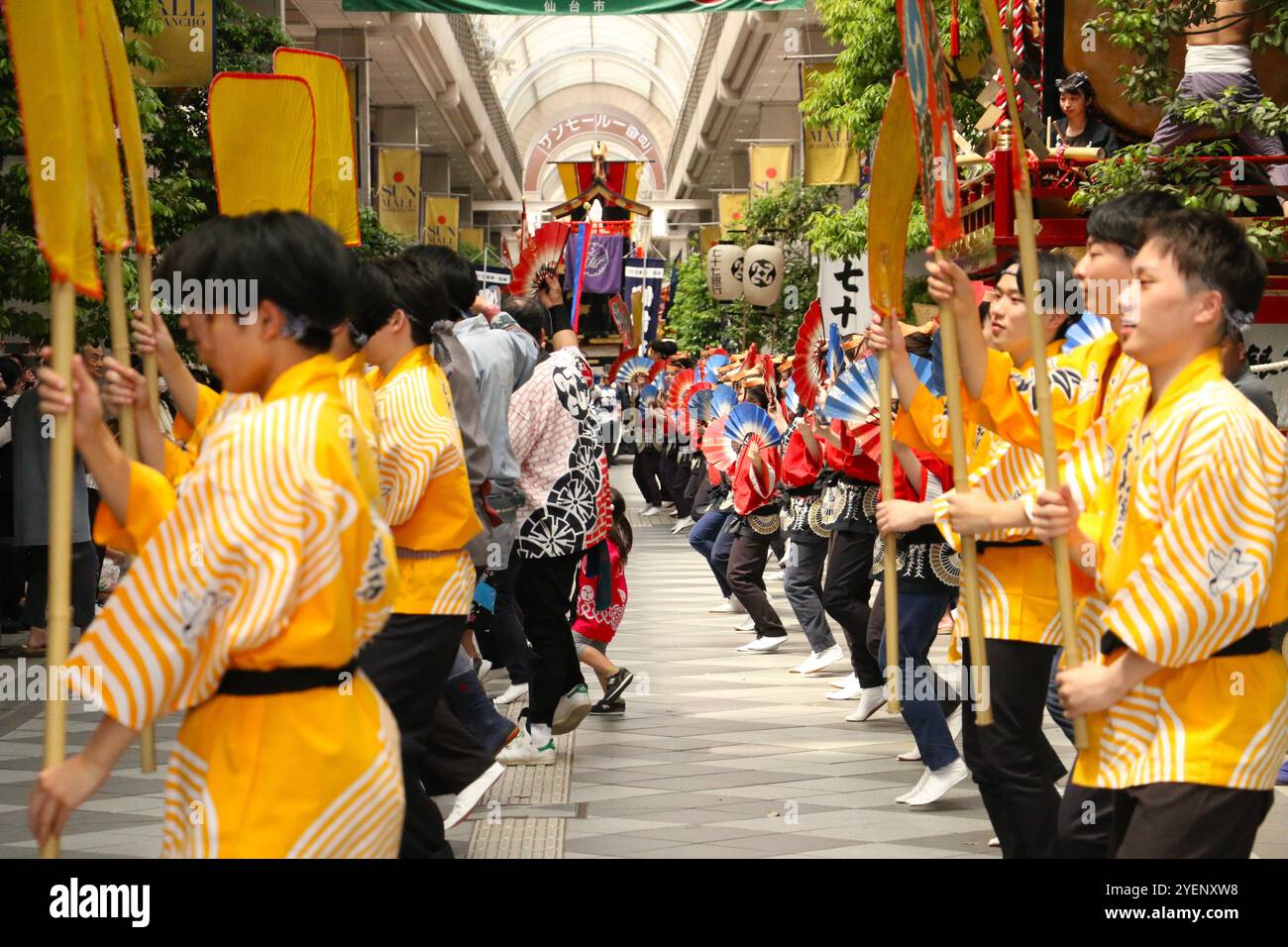 Dancers and parade floats in downtown Sendai preparing to march for the ...