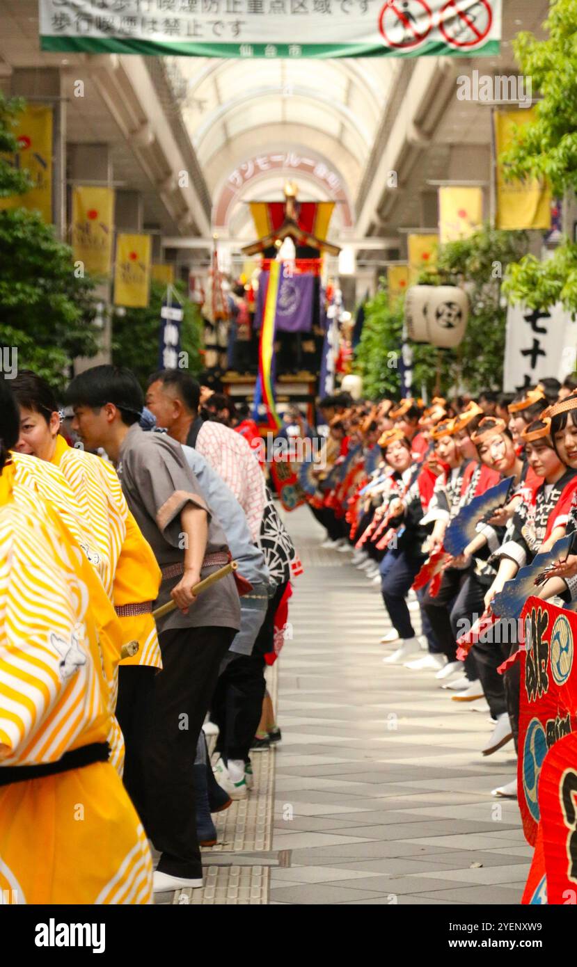 Dancers and parade floats in downtown Sendai preparing to march for the ...