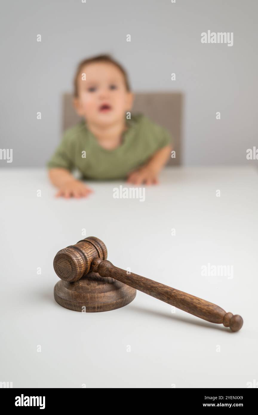 Little boy behind judge's gavel Stock Photo - Alamy