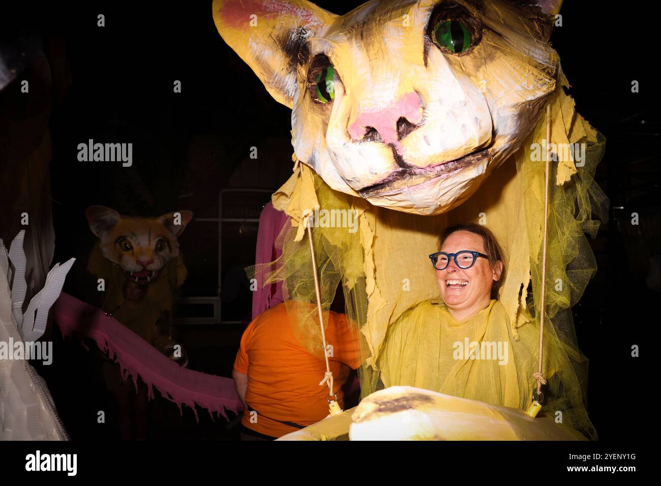 Performers dressed in a cat theme dance as they line up during the 51st ...
