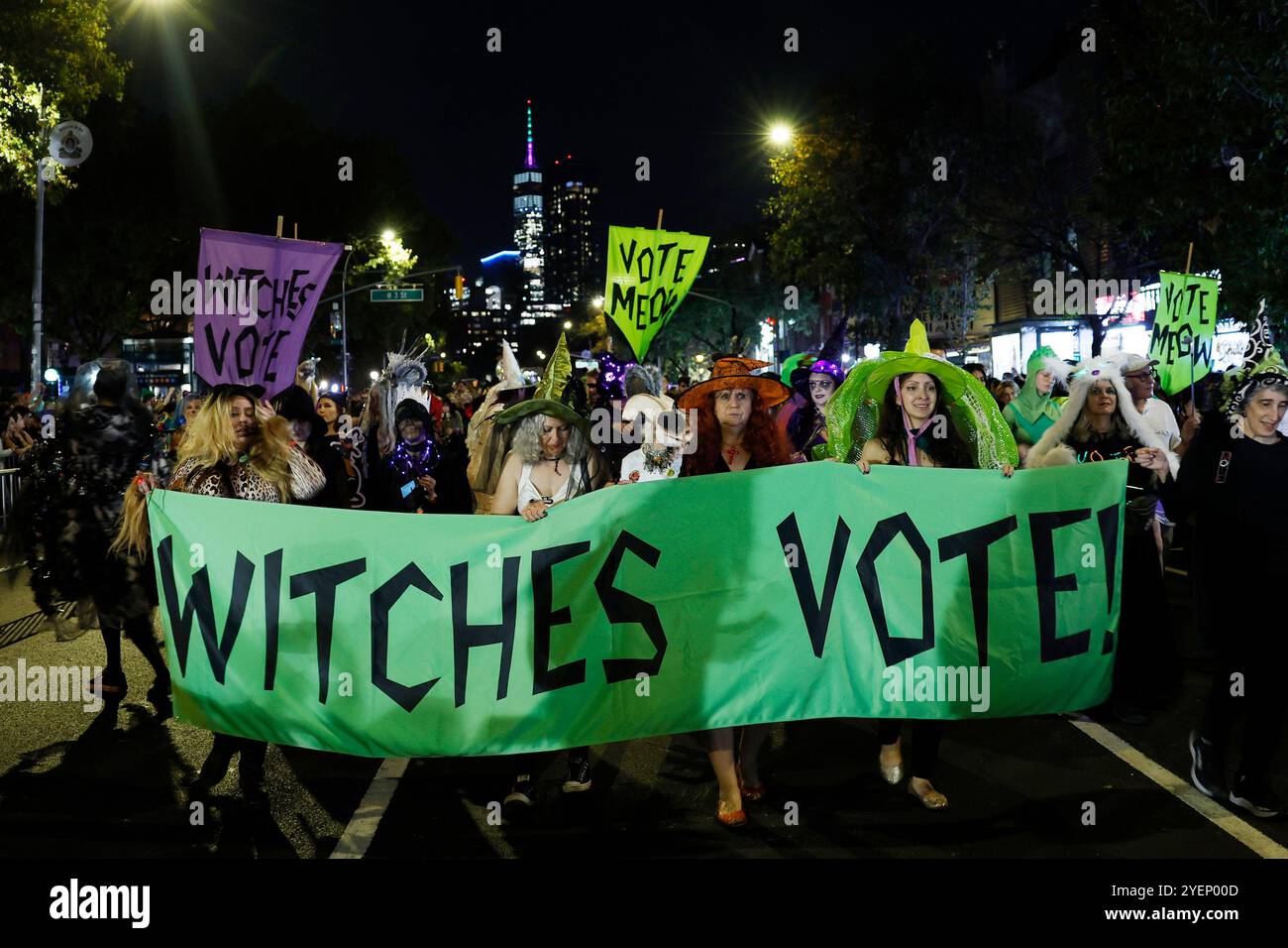 New York, United Stated. 31st Oct, 2024. Participants hold a Witches ...