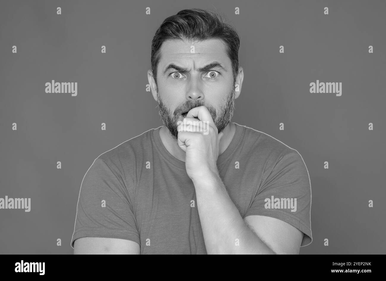 Thinking concept. Portrait of focused smart and creative man, holding ...