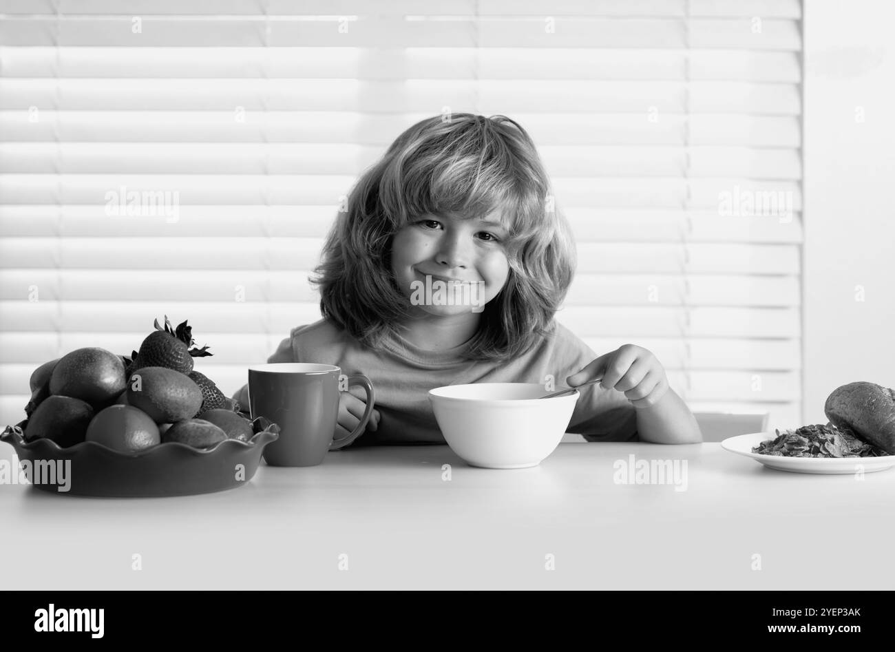 Little child boy having healthy breakfast. Kids nutrition and ...