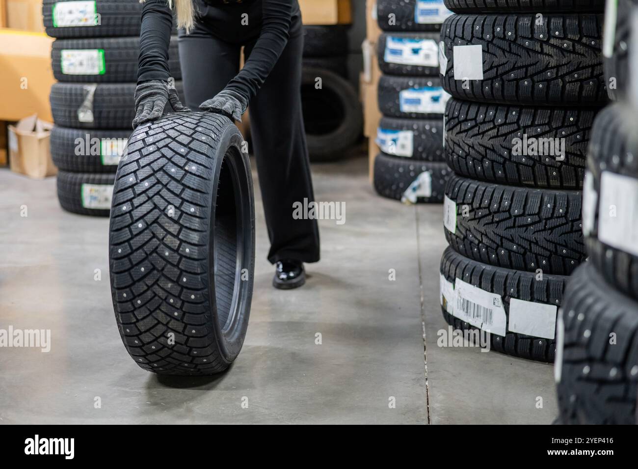 Mechanic keeps new studded car tires in garage Stock Photo - Alamy