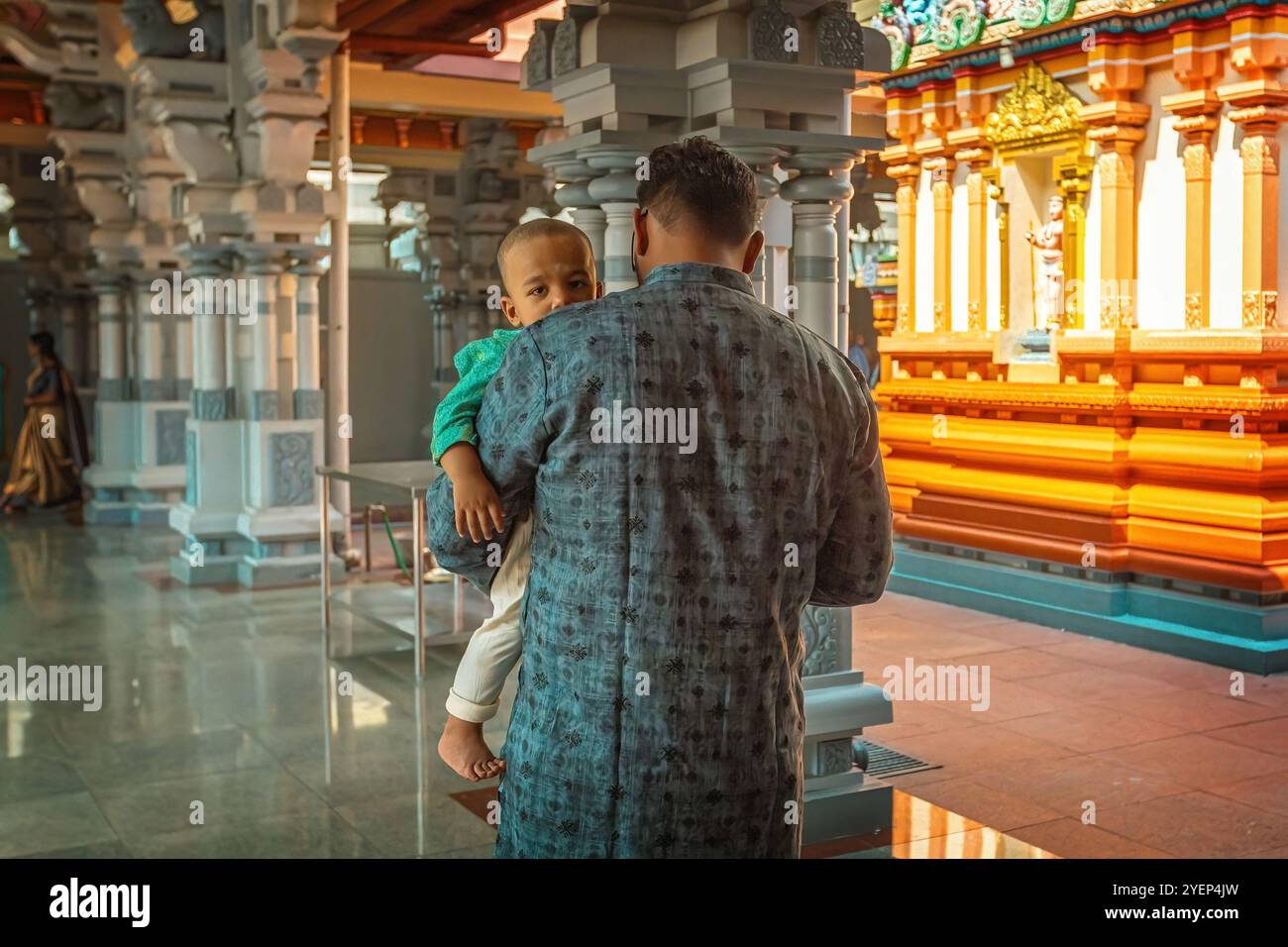 Hindu people father with son in indian teple for Diwali celebration ...