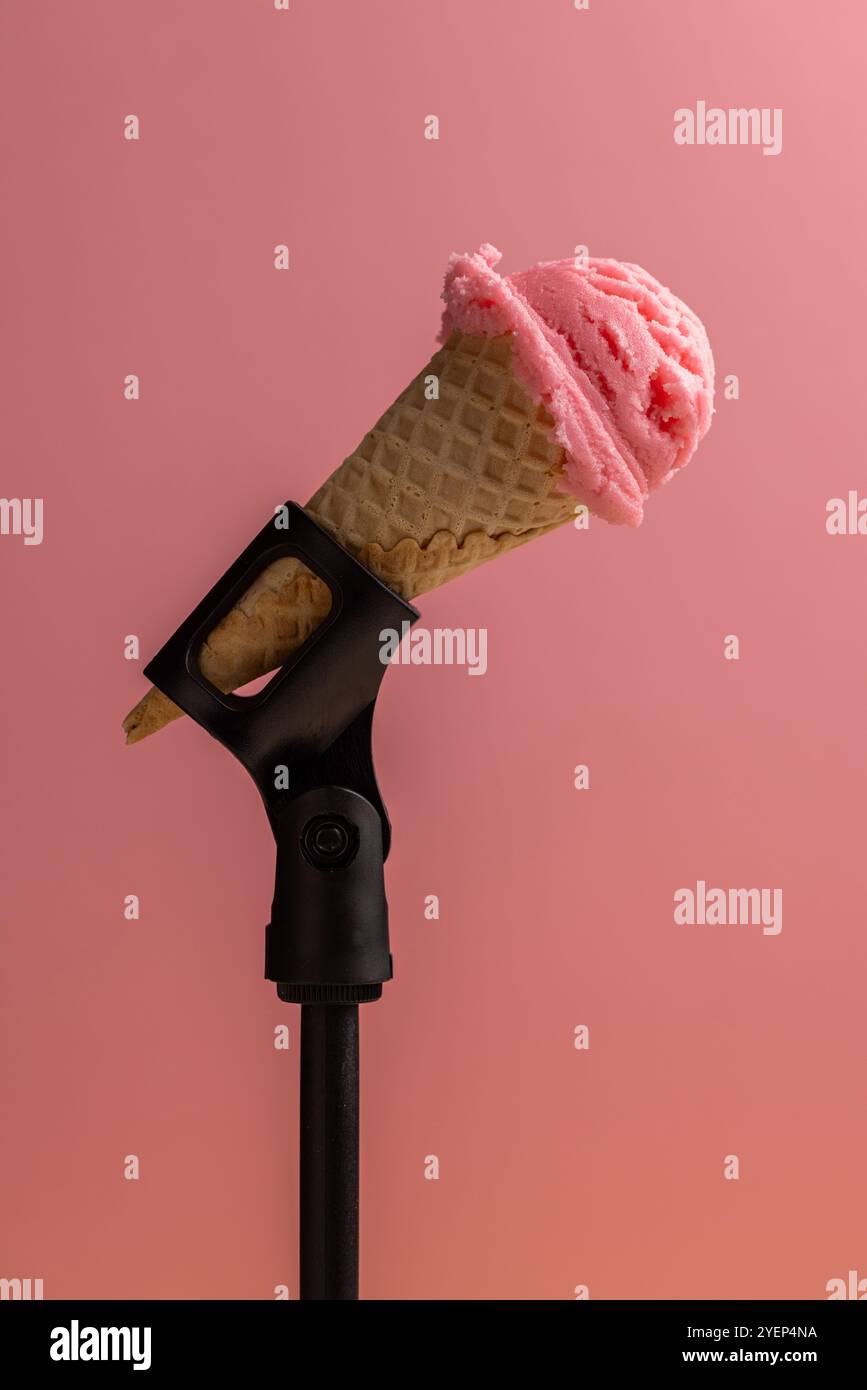 A ball of ice cream in a cone in a microphone stand, the concept of the ...