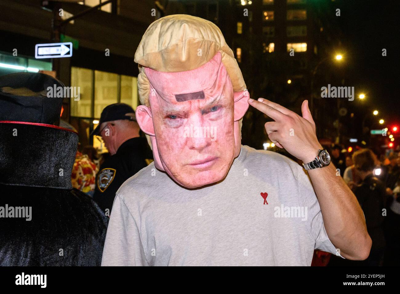 New York, USA, 31 October 2024. A reveller wears a mask of Republican ...