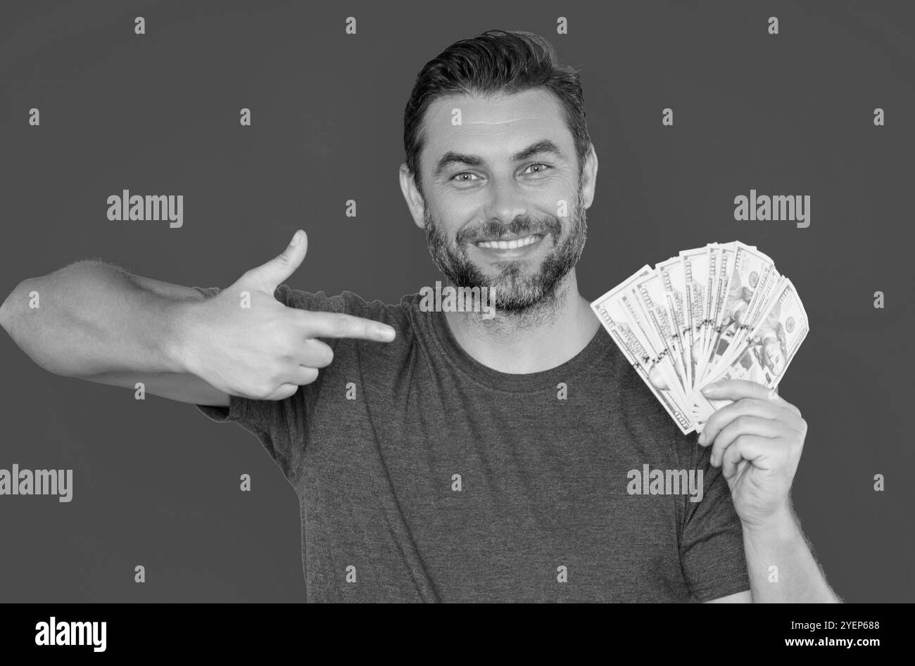 Handsome man pointing dollar Black and White Stock Photos & Images - Alamy