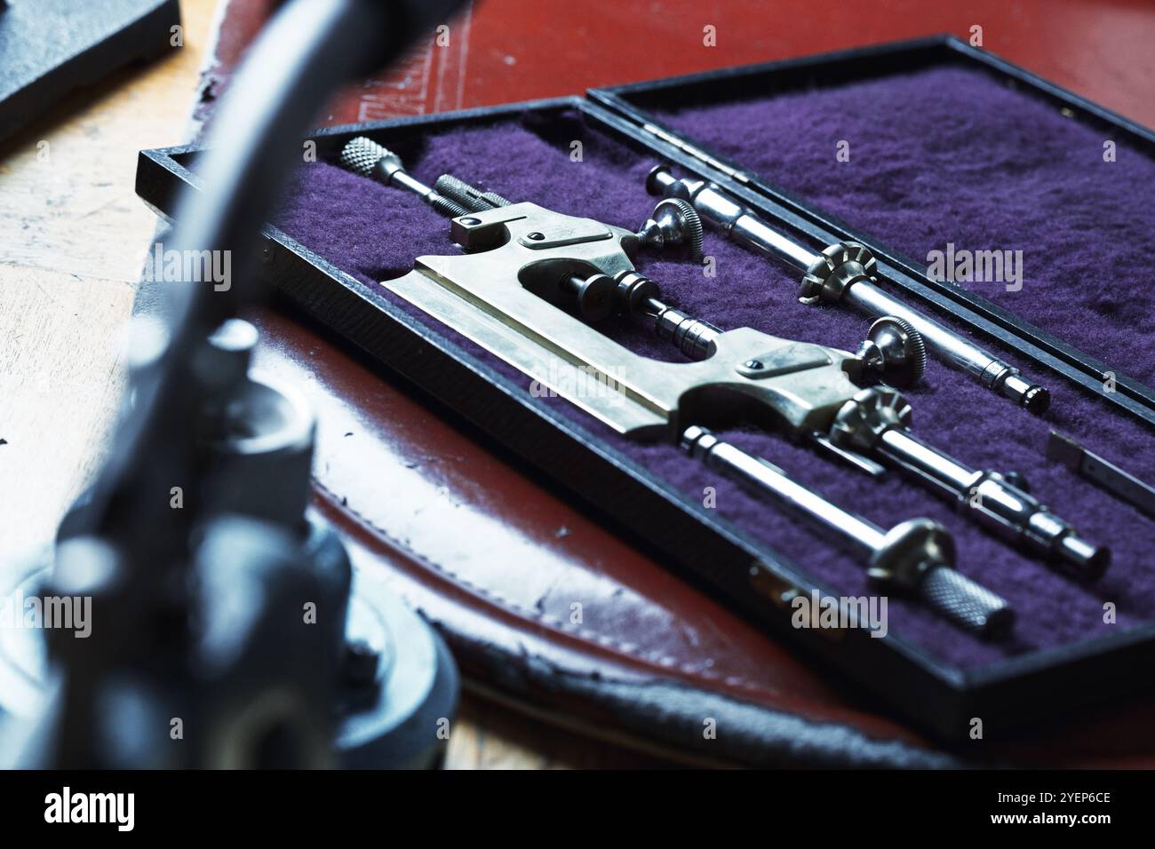 Precision tools arranged on a purple velvet-lined case, designed for ...