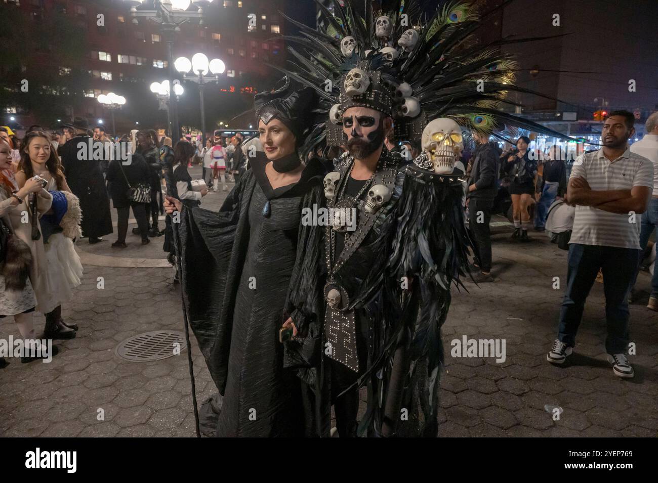 NEW YORK, NEW YORK - OCTOBER 31: Revelers dressed in costumes pose at ...