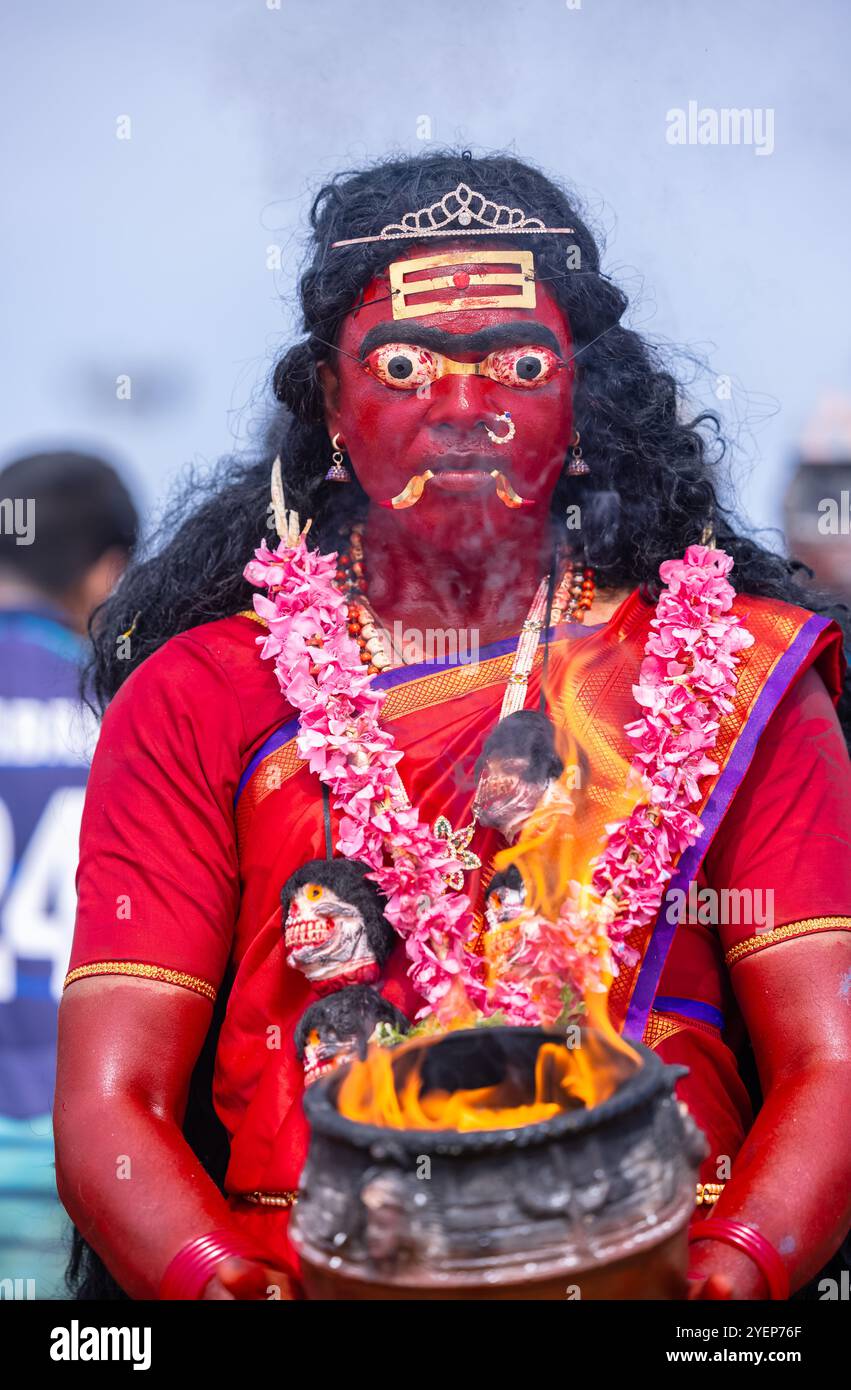 Kulasai Dasara, Portrait of indian hindu devotee with painted face and ...