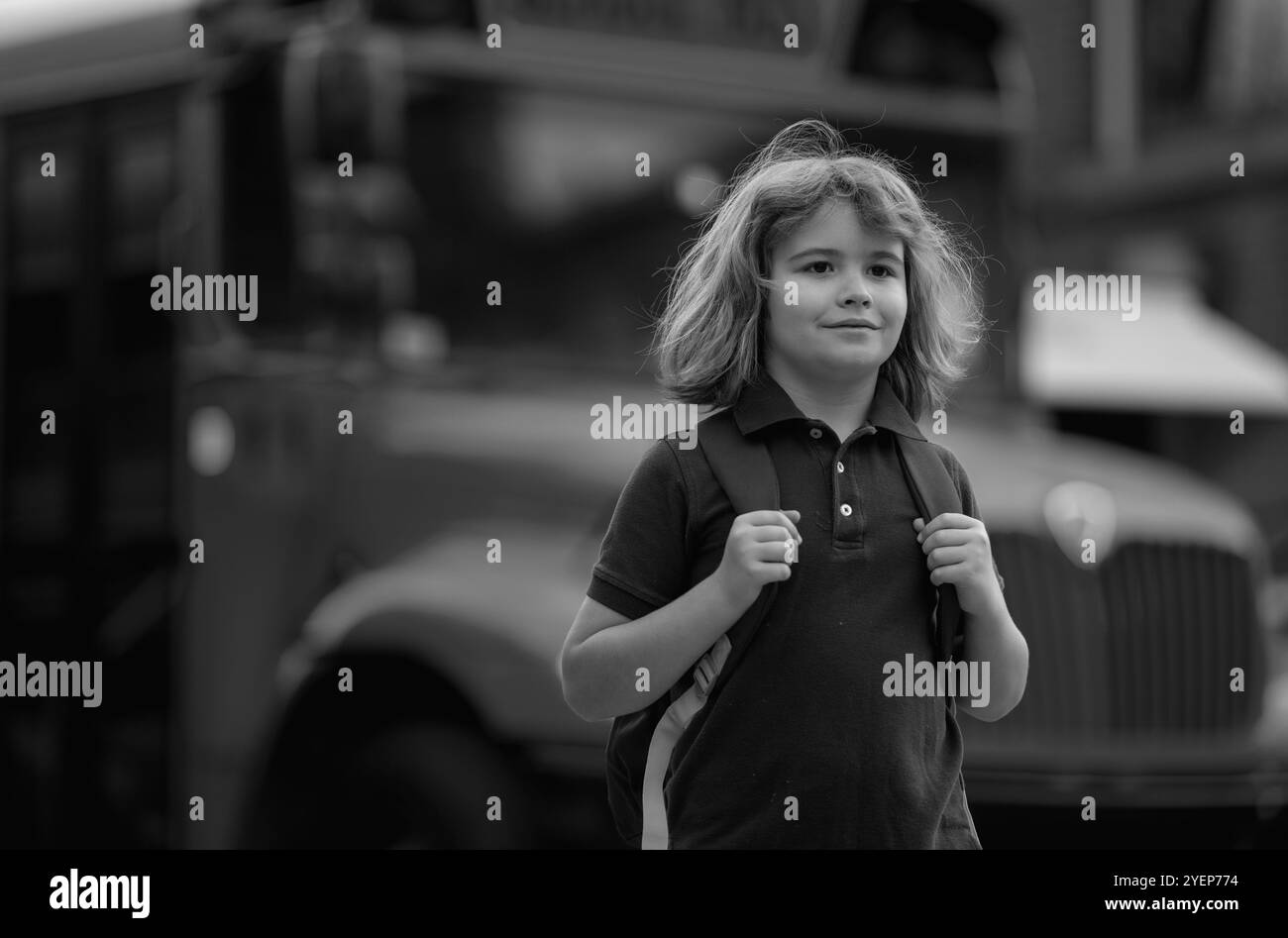 Schoolchild getting on the school bus. American School. Back to school ...