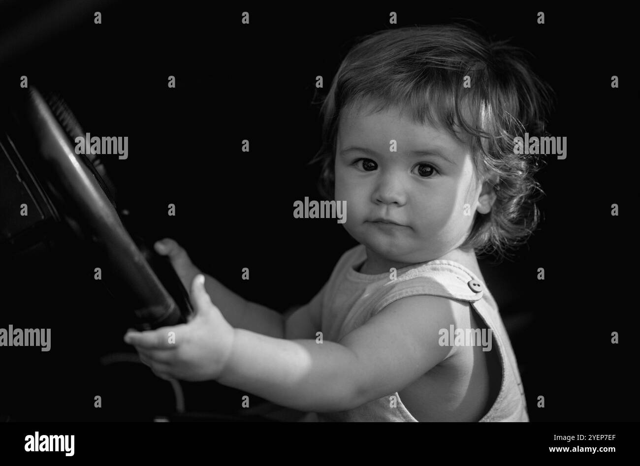 Child Driver. Baby in car with his hands on the wheel. Child Driver ...