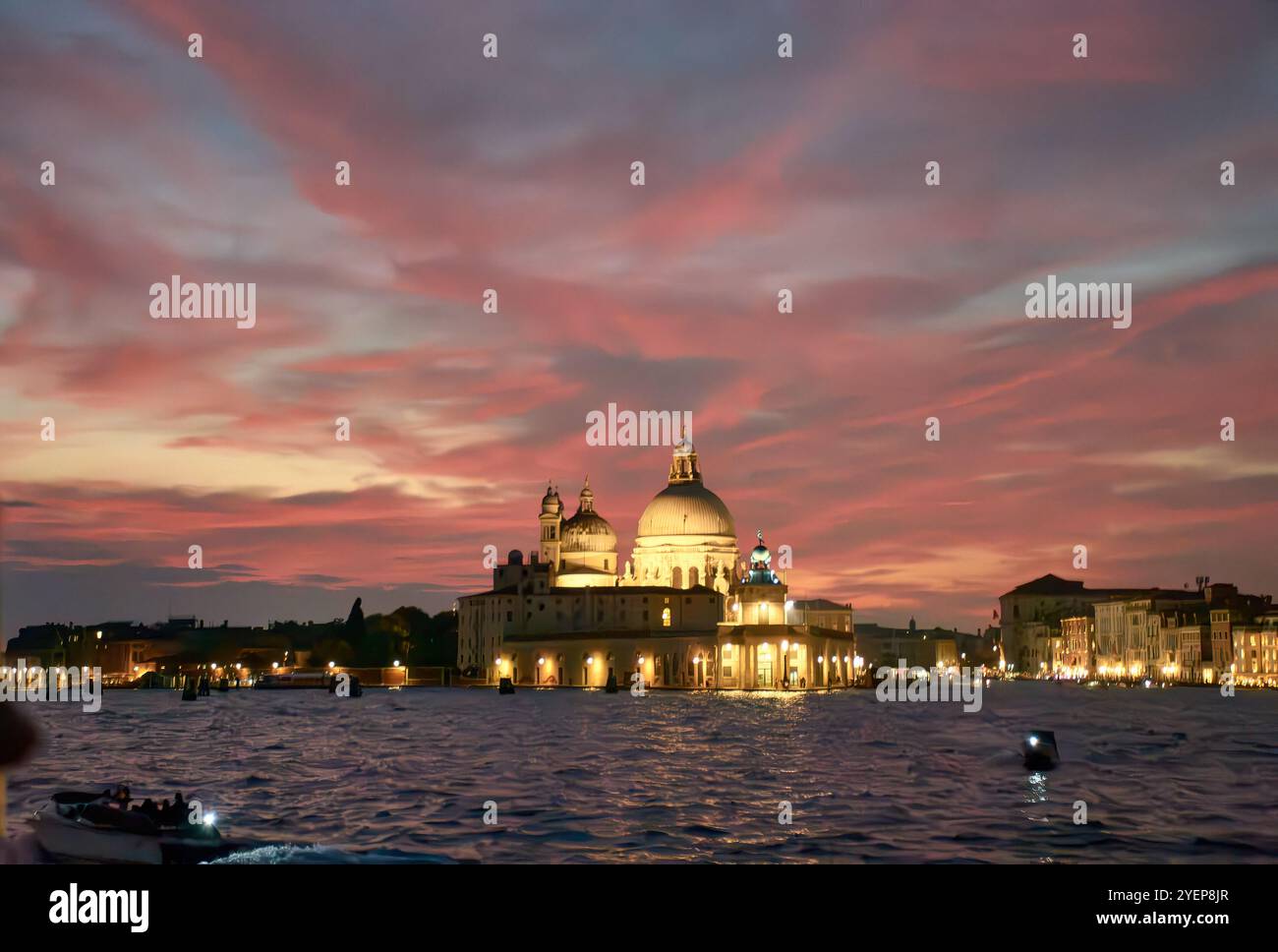 A breathtaking view of Venice at sunset. The city's iconic skyline is ...