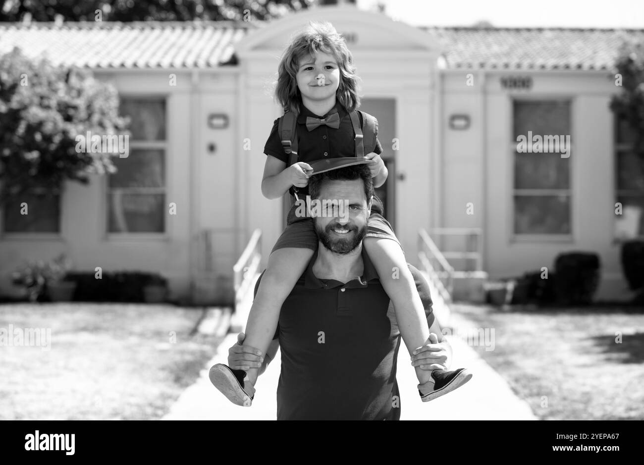 Father get a son pupil piggyback ride after study school. Family ...
