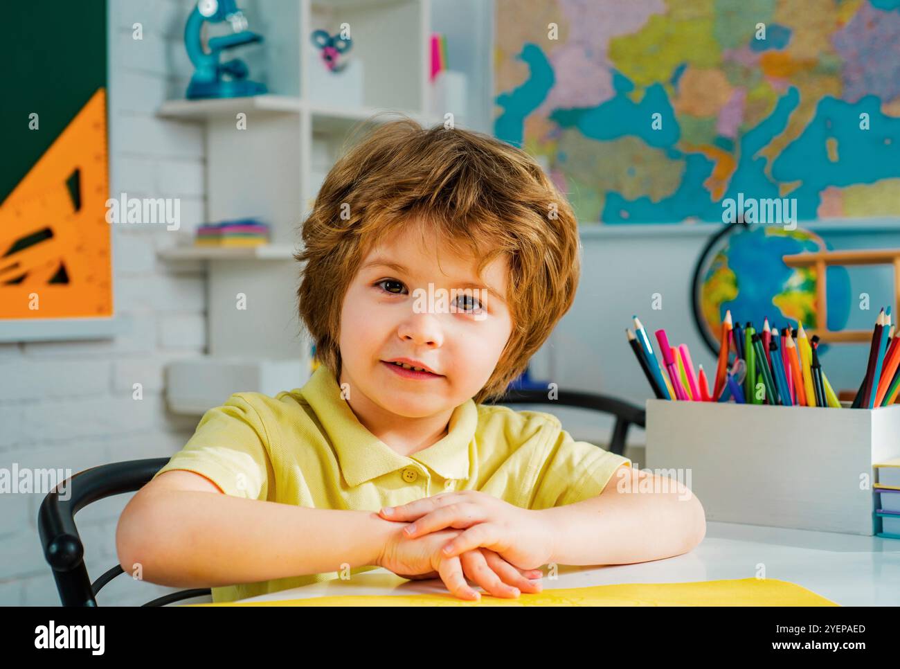 Portrait of elementary pupil looking at camera. Kids from primary ...
