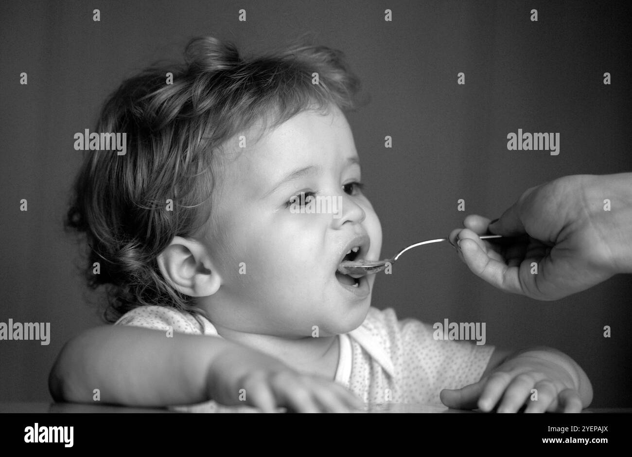 Family, food, child, eating and parenthood concept. Feeding kids. Not ...