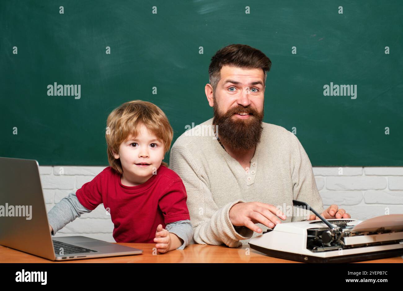 Chalkboard copy space. Teacher teaches a student to use a microscope ...