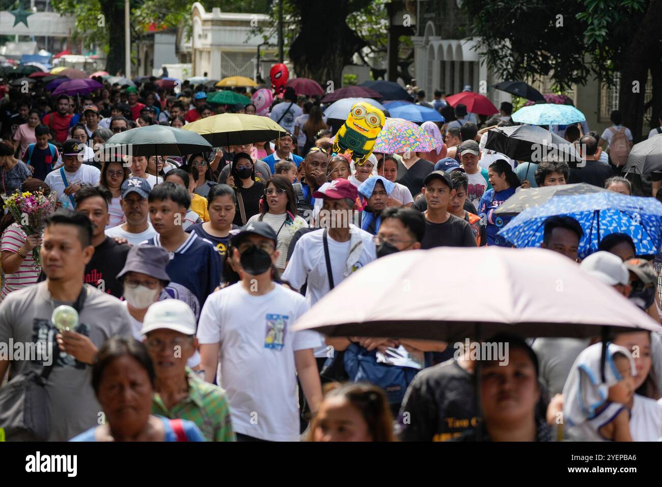 People make their way at a crowded Manila's North Cemetery, Philippines ...