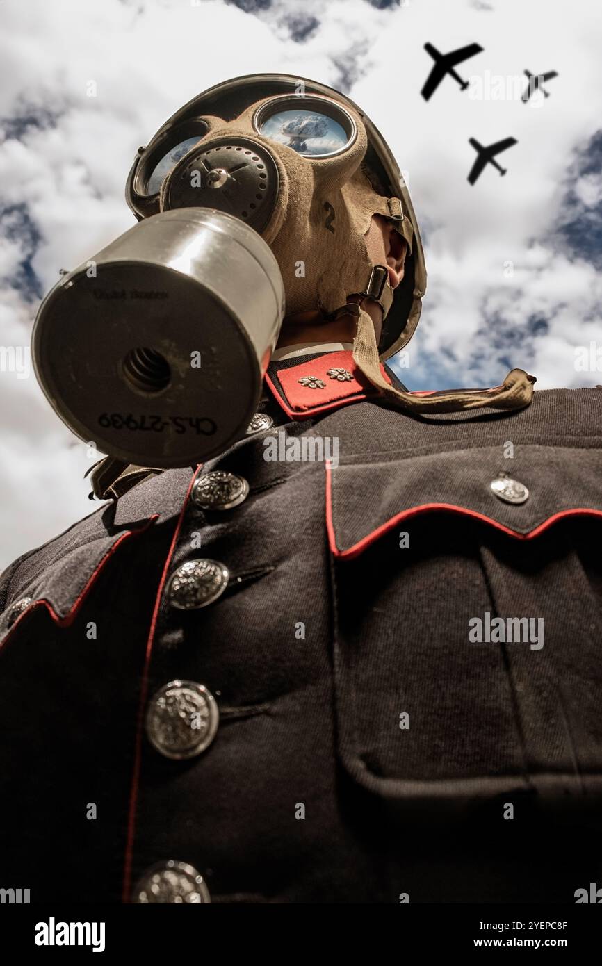 Uniformed man with gas mask under the sky with flying planes Stock ...
