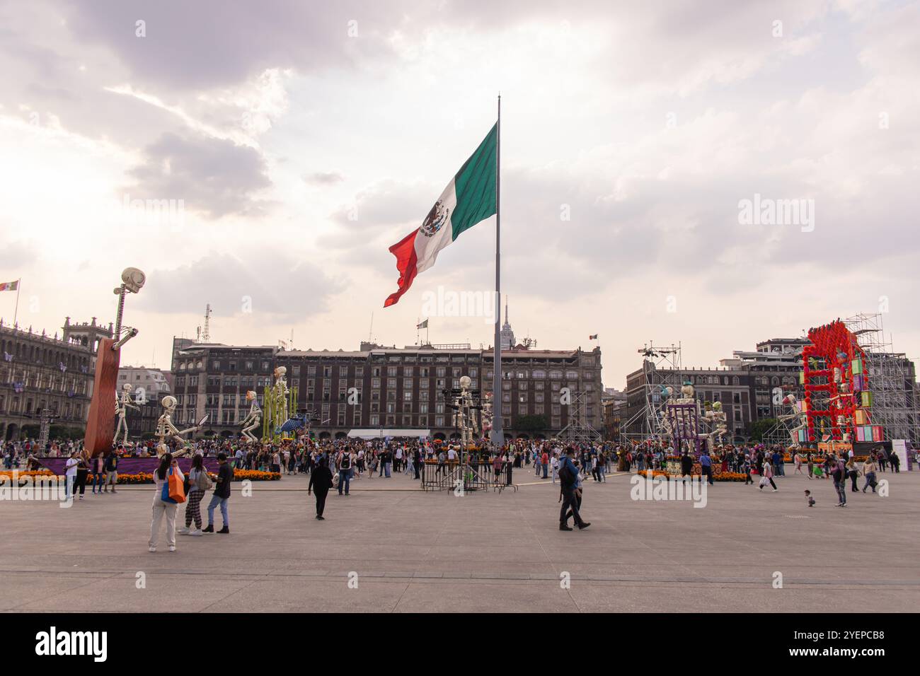 Large Mexican flag flies over Zócalo, surrounded by Day of the Dead ...