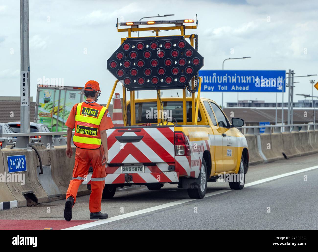 BANGKOK, THAILAND, JUNE 01 2024, Road maintenance man with a car parked ...