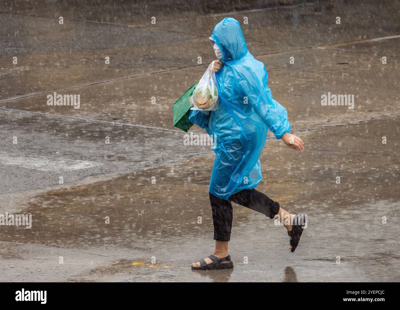 Raincoat wind hi-res stock photography and images - Alamy