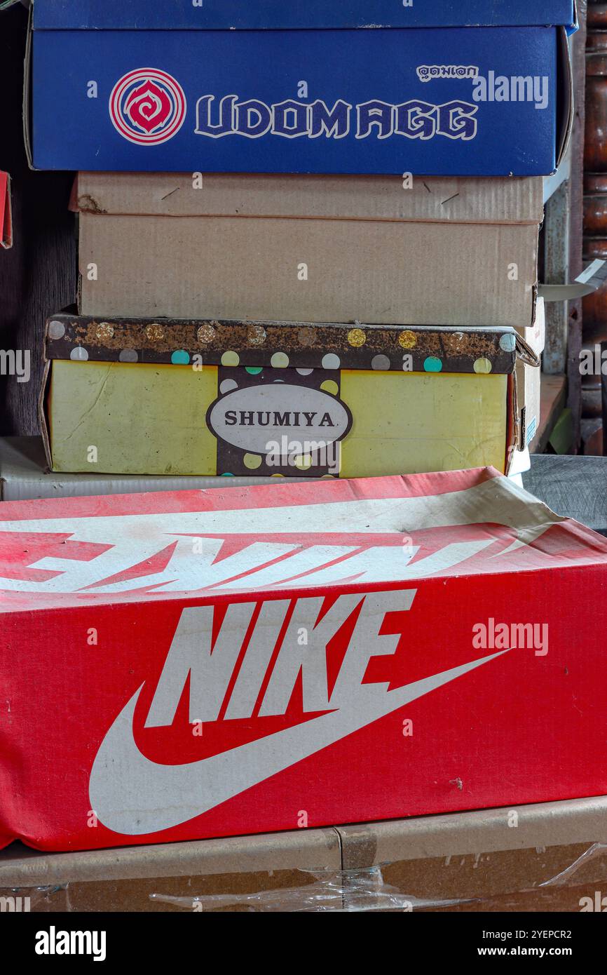 Dusty shoe boxes of various brands Stock Photo - Alamy