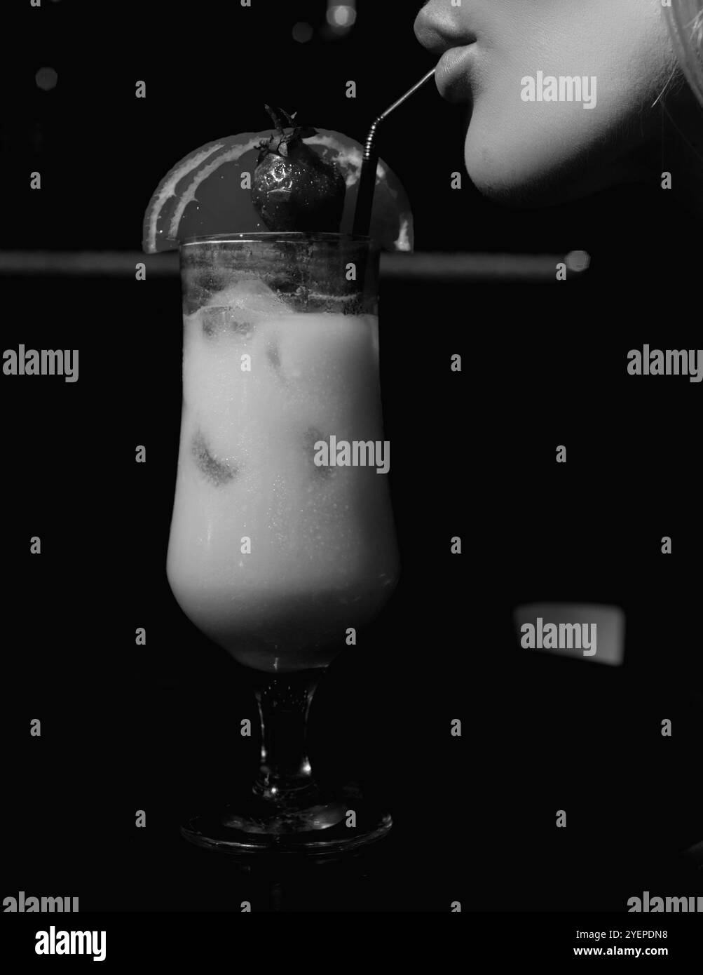 Close up of girl with sensual lips and mouth drinking cocktails ...