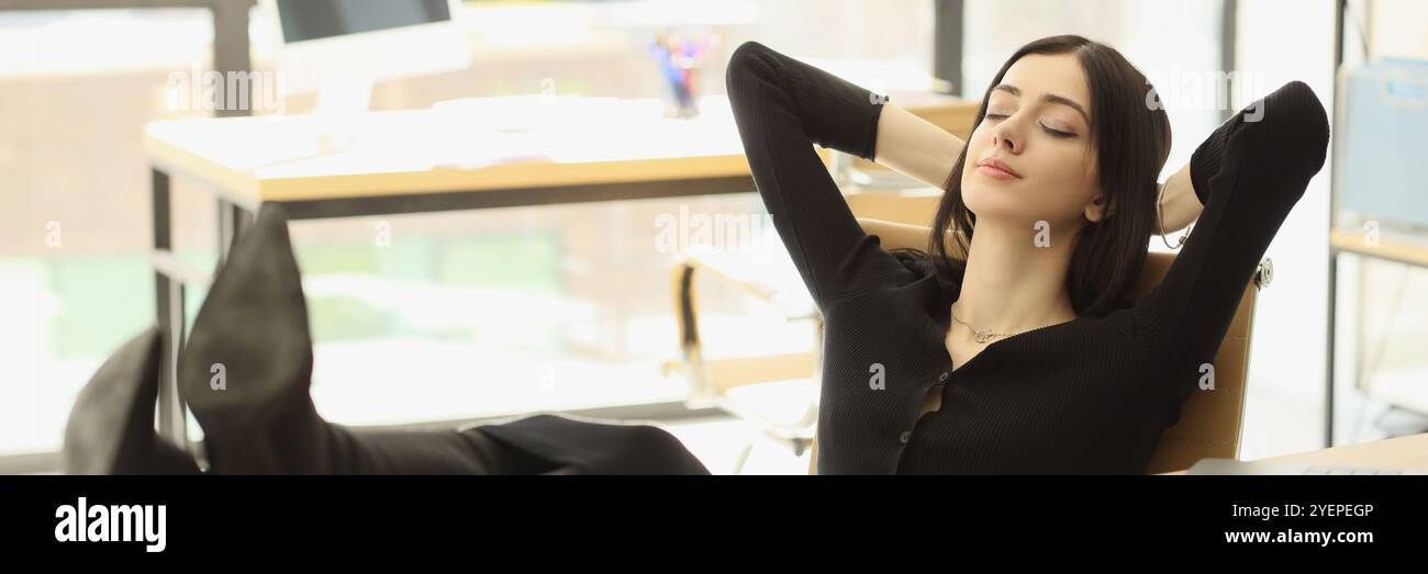 Relaxed lady puts feet on table taking break at workplace Stock Photo ...