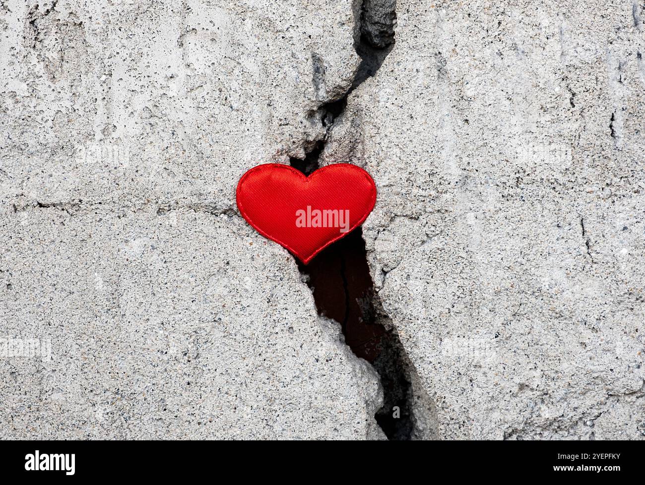 Red Heart Shape in the Crack of the Wall Stock Photo - Alamy