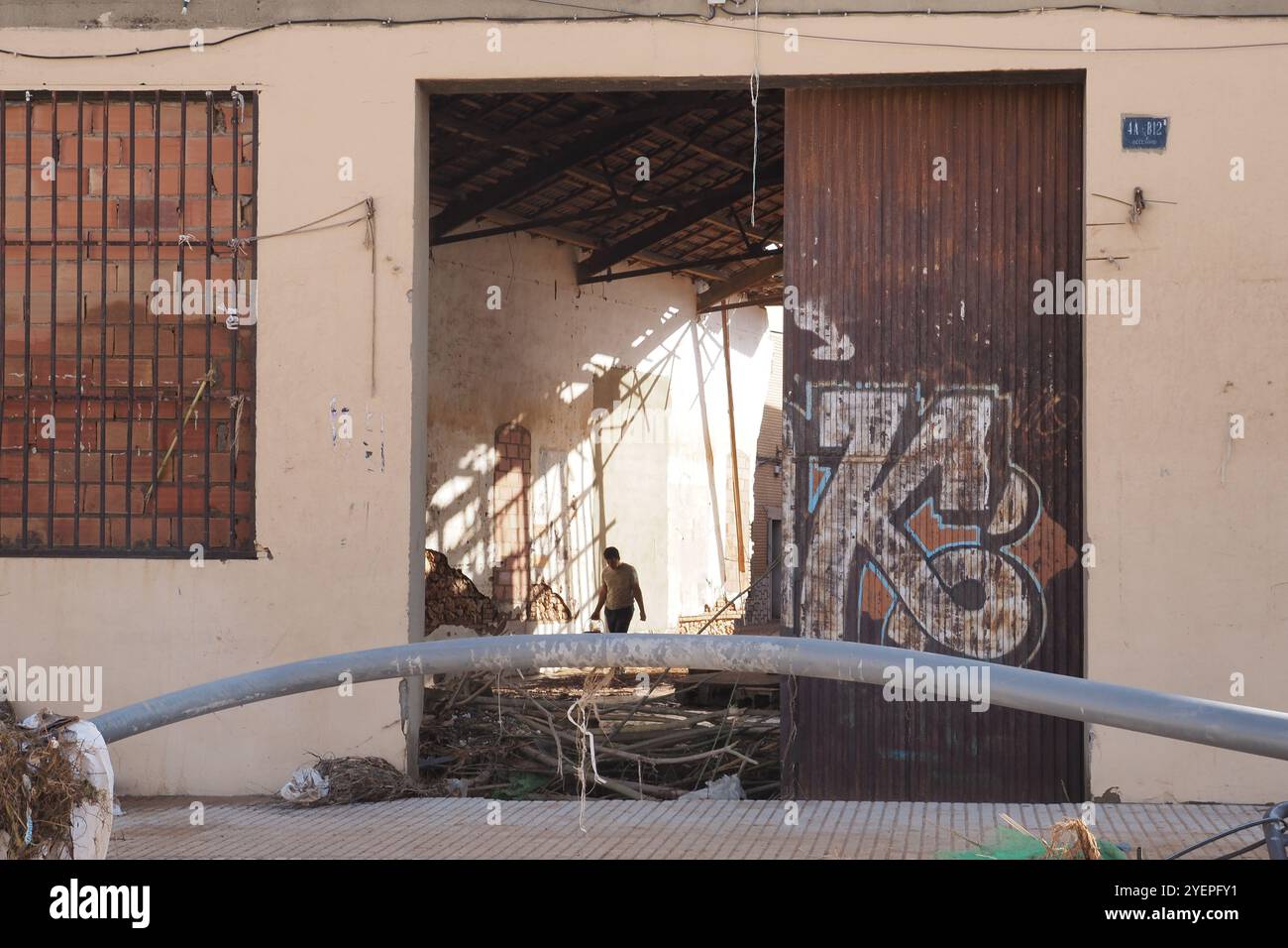 The aftermath of hurricane Dana in Valencia, Spain - Worker inspecting ...
