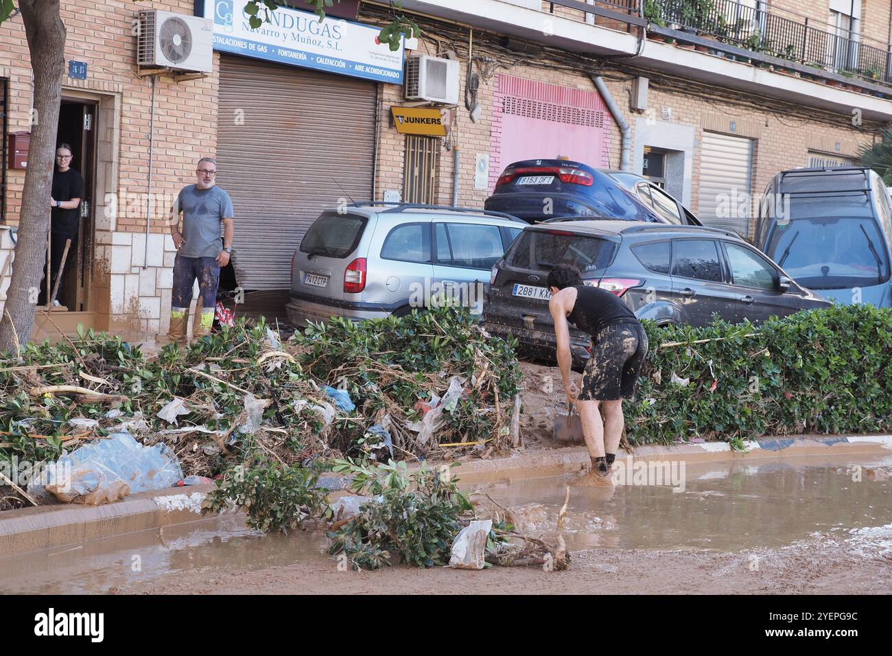 The aftermath of hurricane Dana in Valencia, Spain - Volunteer removing ...