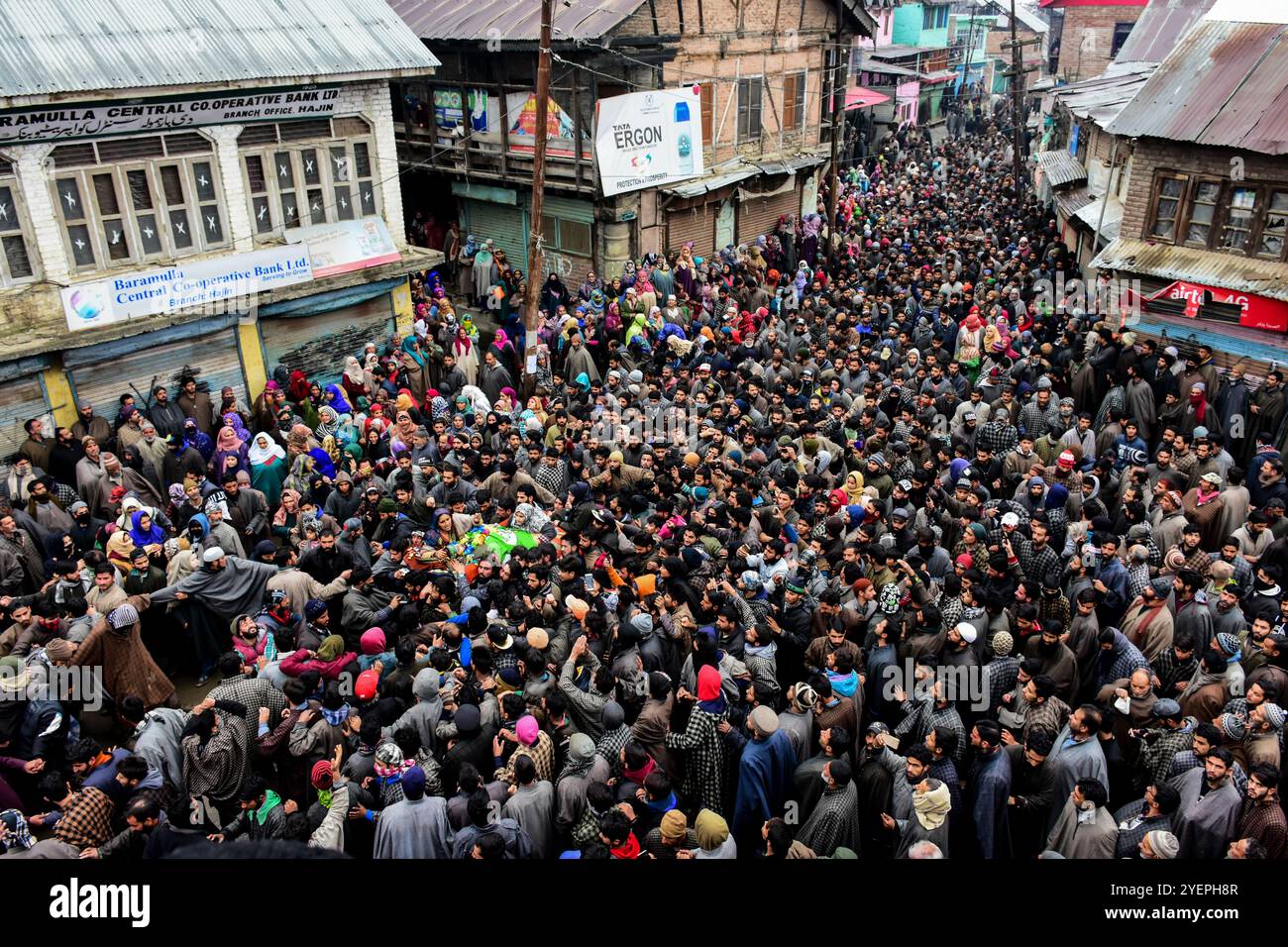 Thousands of mourners carry the body of alleged rebels Mudasir Parray, 14, and Mudasir Parray ...