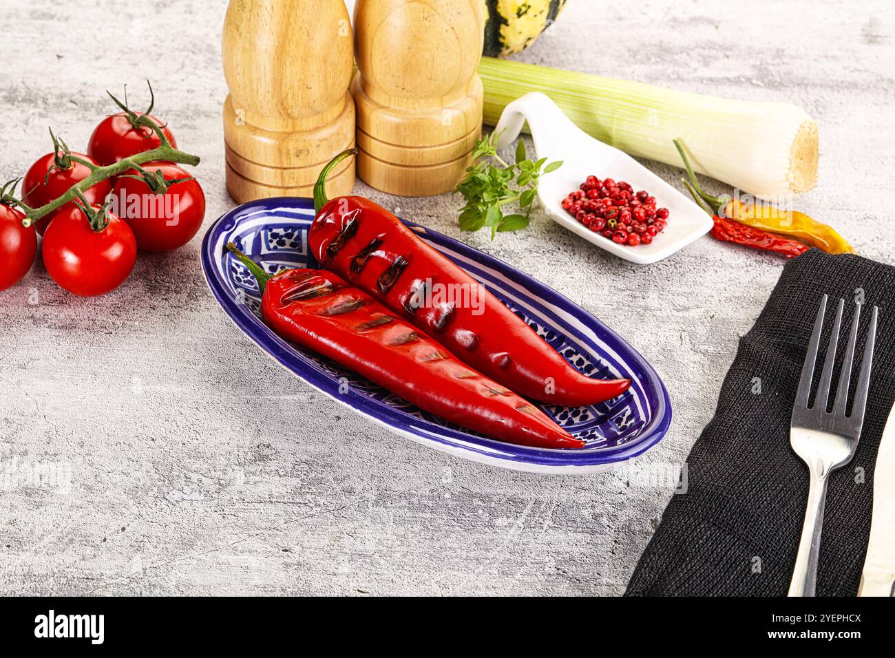 Grilled red spicy pepper snack in the bowl Stock Photo - Alamy