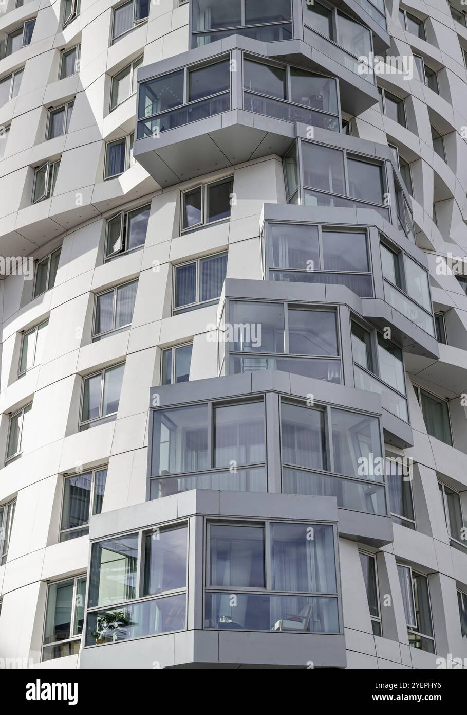 London, UK - Oct 16, 2023 - Details of housing in Battersea have rippled white facades structure ...