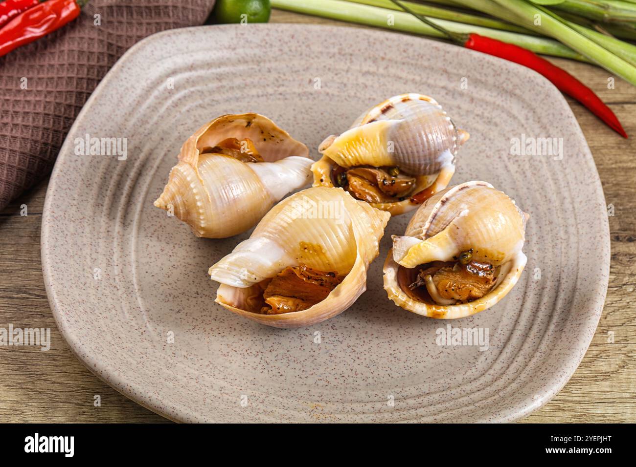 Delicous Snails baked with garlic and spices Stock Photo - Alamy