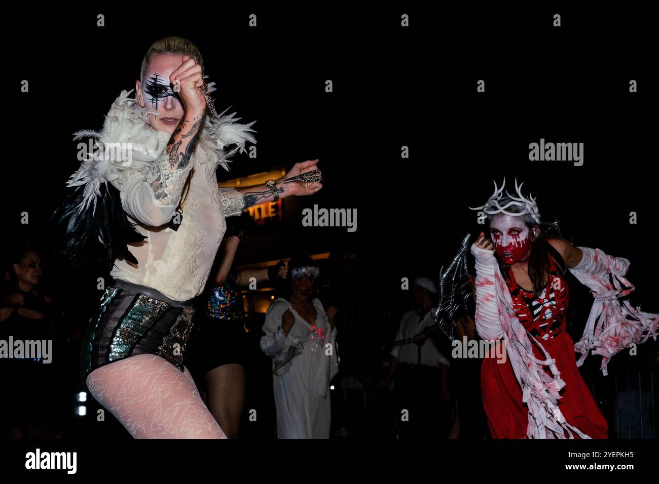 New York, United States. 31st Oct, 2024. Costumed parade goers dance ...