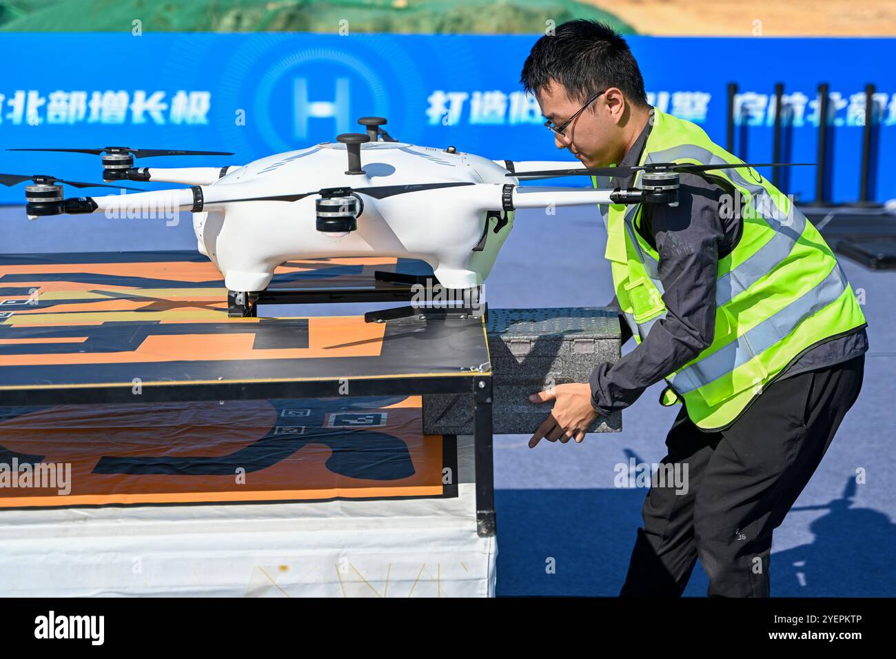 Drone delivery demonstration at the event. Guangzhou,China.31st October ...
