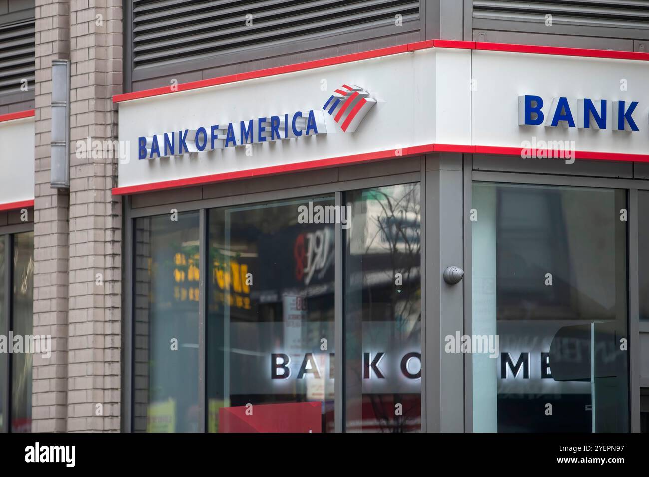 The image displays the exterior of a Bank of America branch, featuring ...