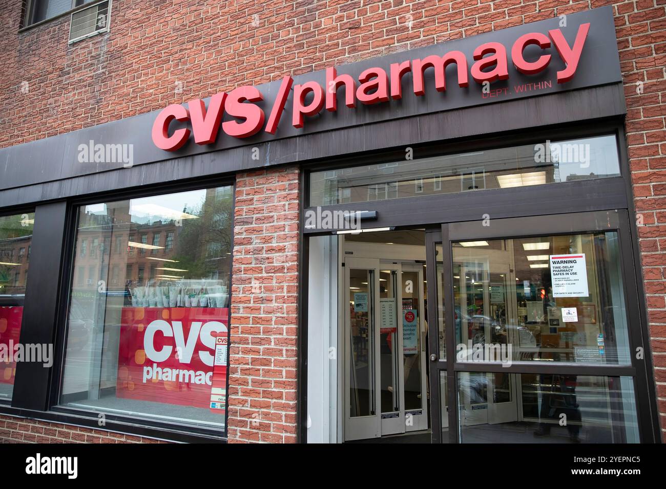 This image shows the storefront of a CVS Pharmacy, with its bold red ...