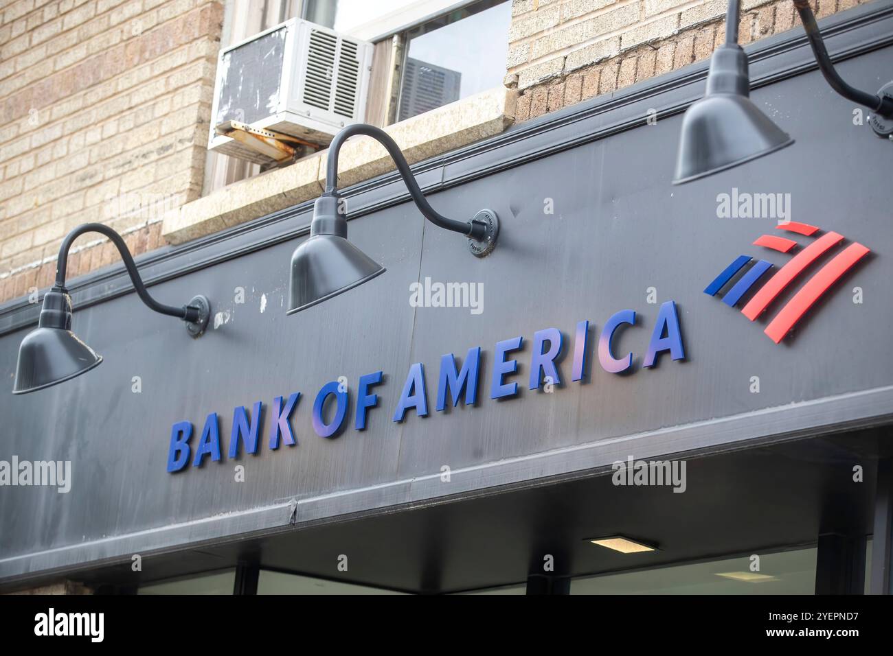 This image shows the storefront of a Bank of America branch, with the ...