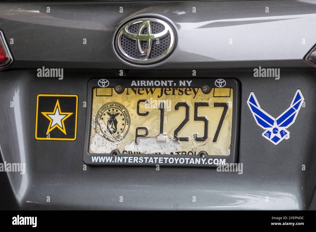 This image shows a New Jersey license plate on a Toyota vehicle, with a ...