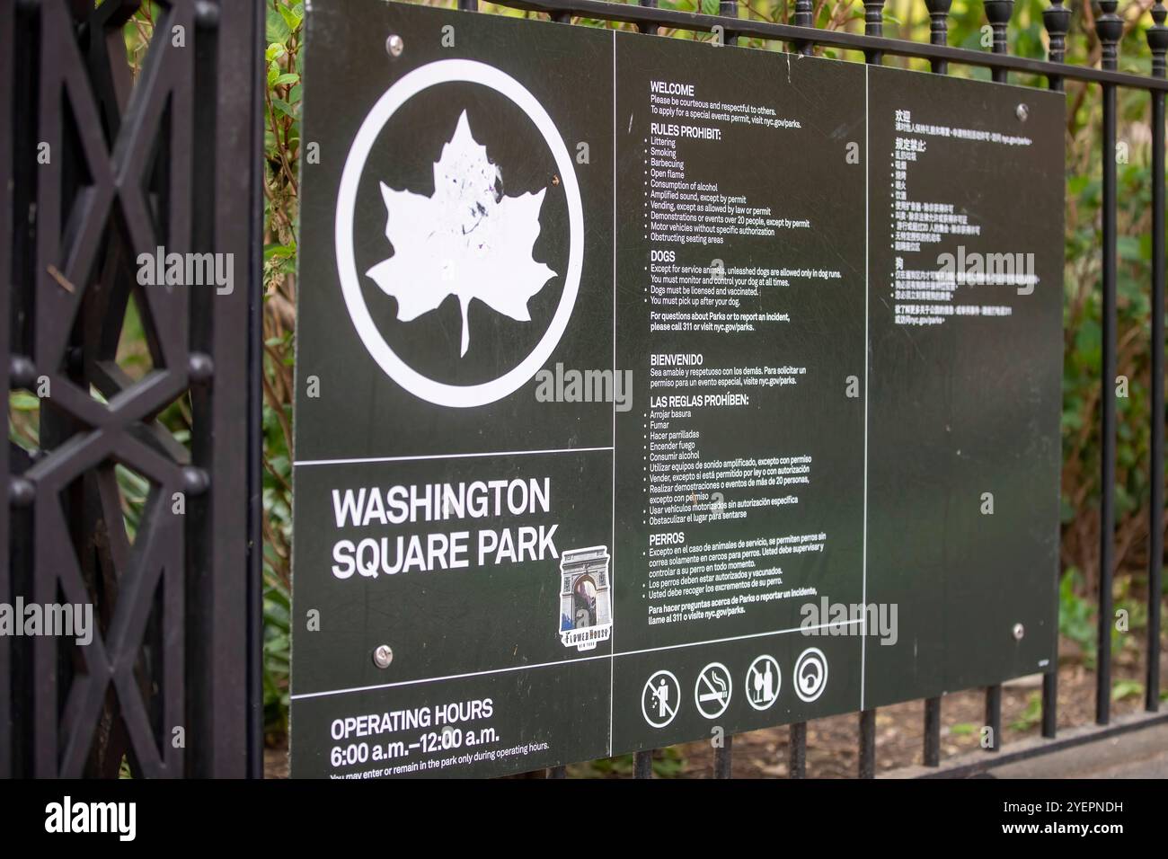 This image shows a sign for Washington Square Park, detailing rules ...